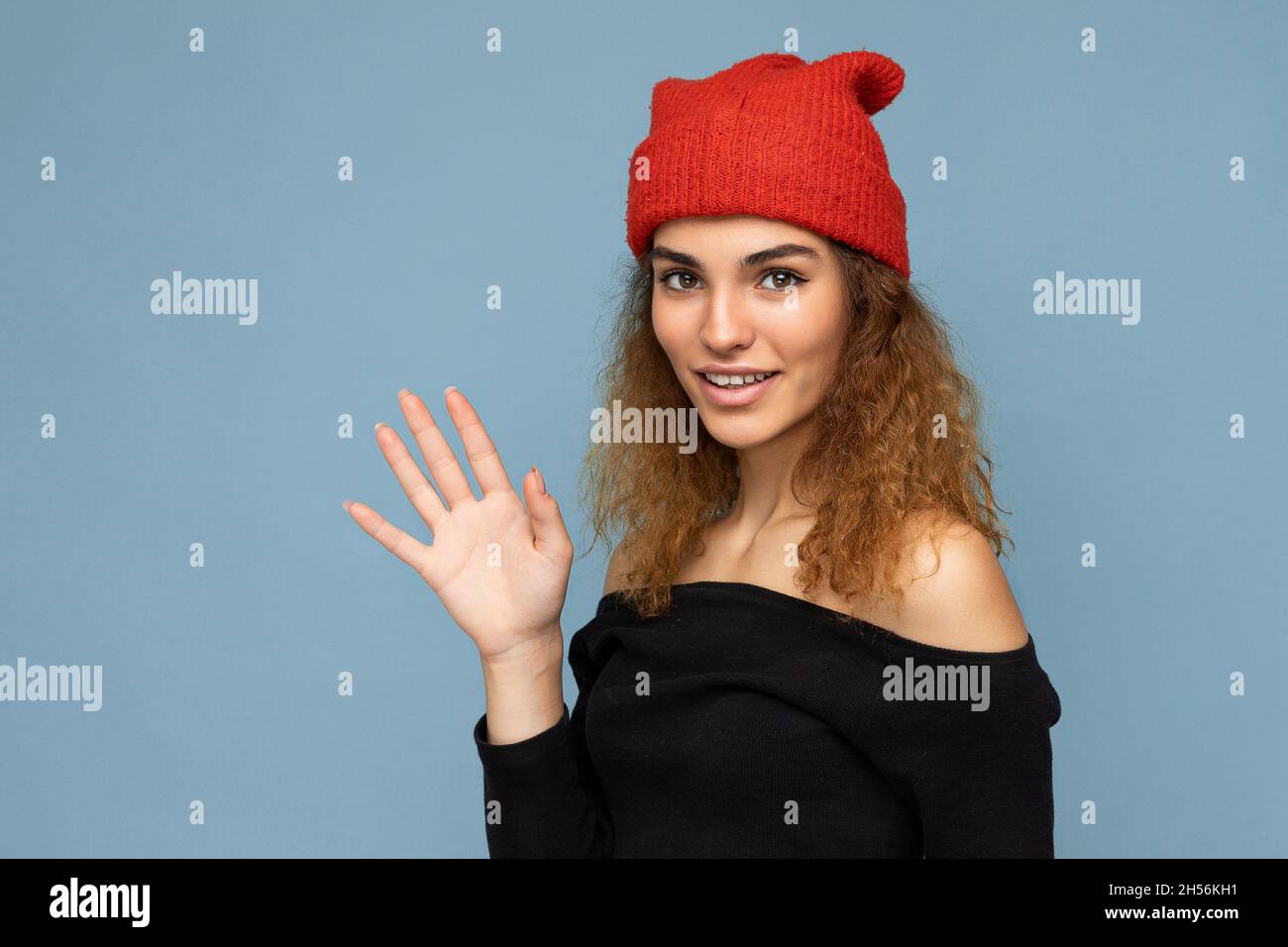 Photo of young positive cute nice brunette woman curly with sincere emotions wearing stylish ...