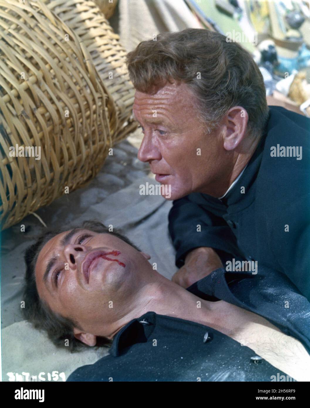 DIRK BOGARDE and JOHN MILLS in THE SINGER NOT THE SONG 1961 director ...
