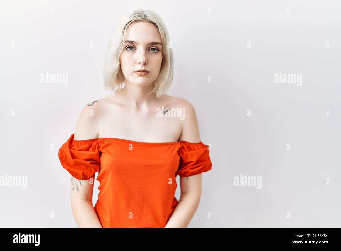 Young caucasian woman standing over isolated background relaxed with ...
