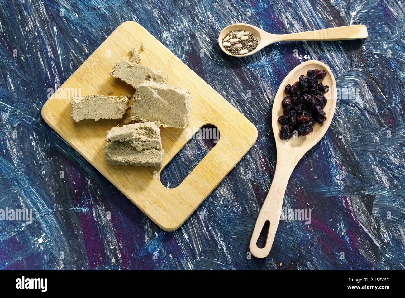 Sunflower halva. Halva pieces black background. Top view Stock Photo - Alamy