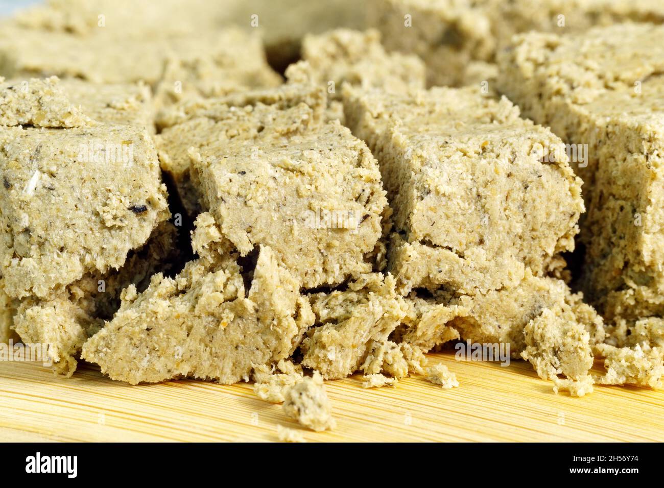 Halva pieces on a wooden board. Close up macro Stock Photo - Alamy