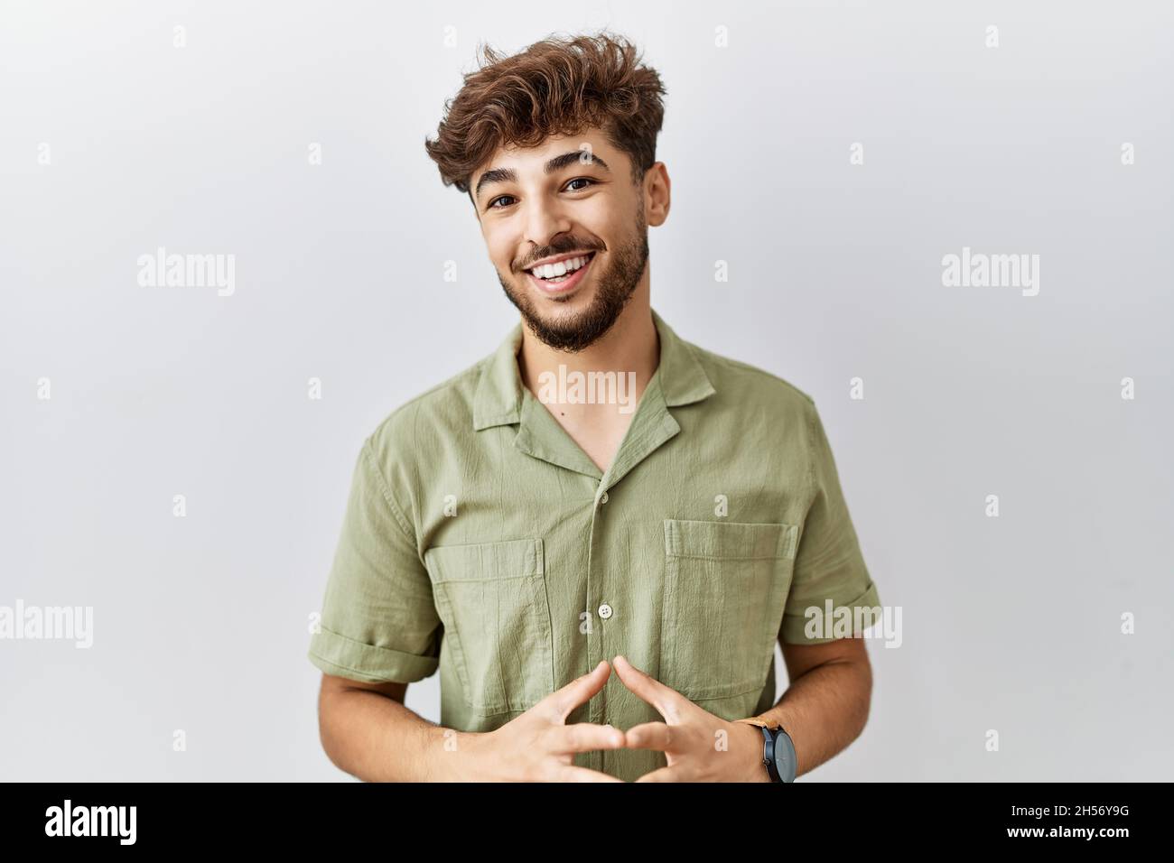 Young arab doctor man standing over isolated background hands together ...