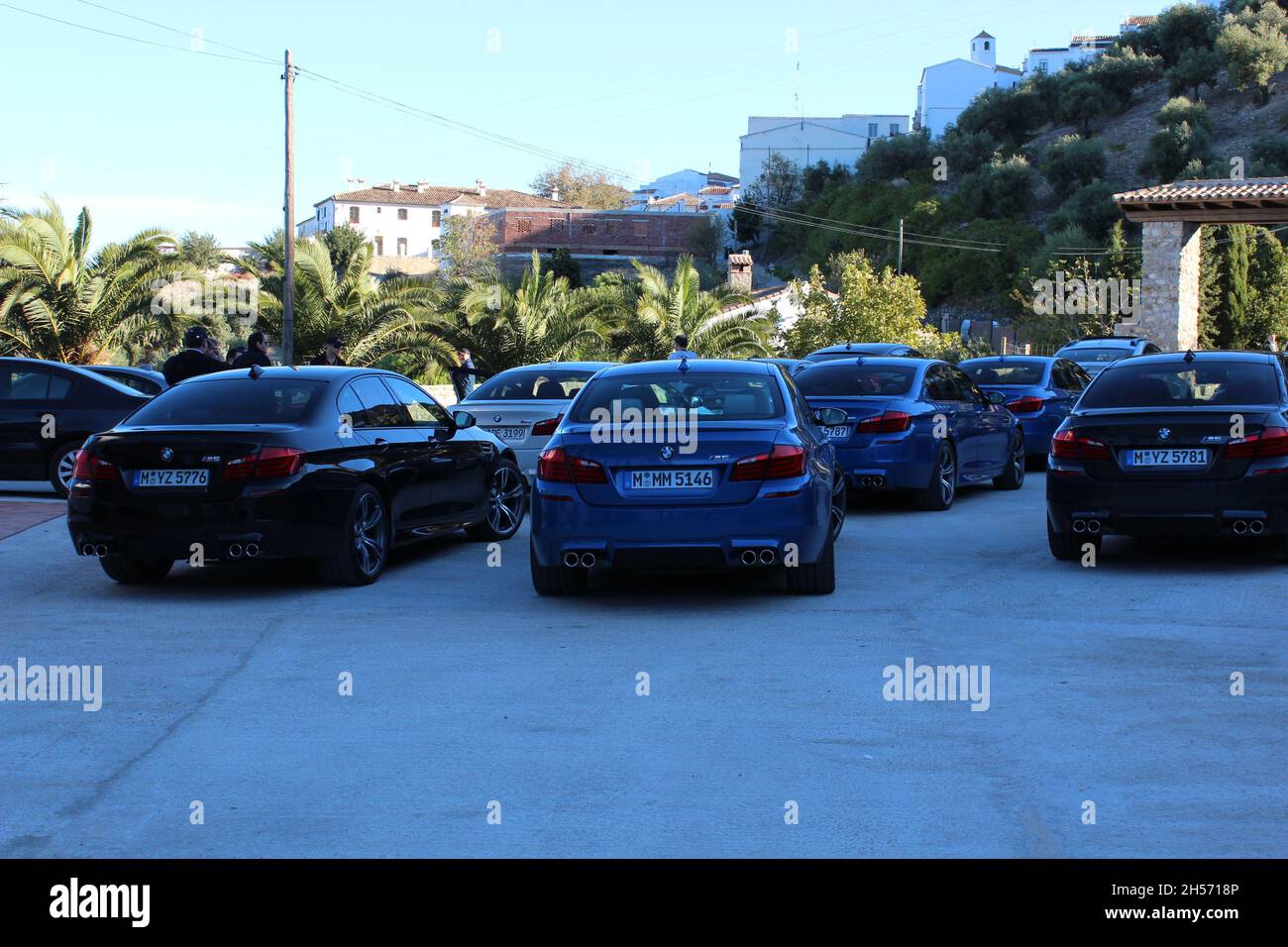 The new BMW M5 (F10): Rear view of parked cars. Manufactured from 2011 ...