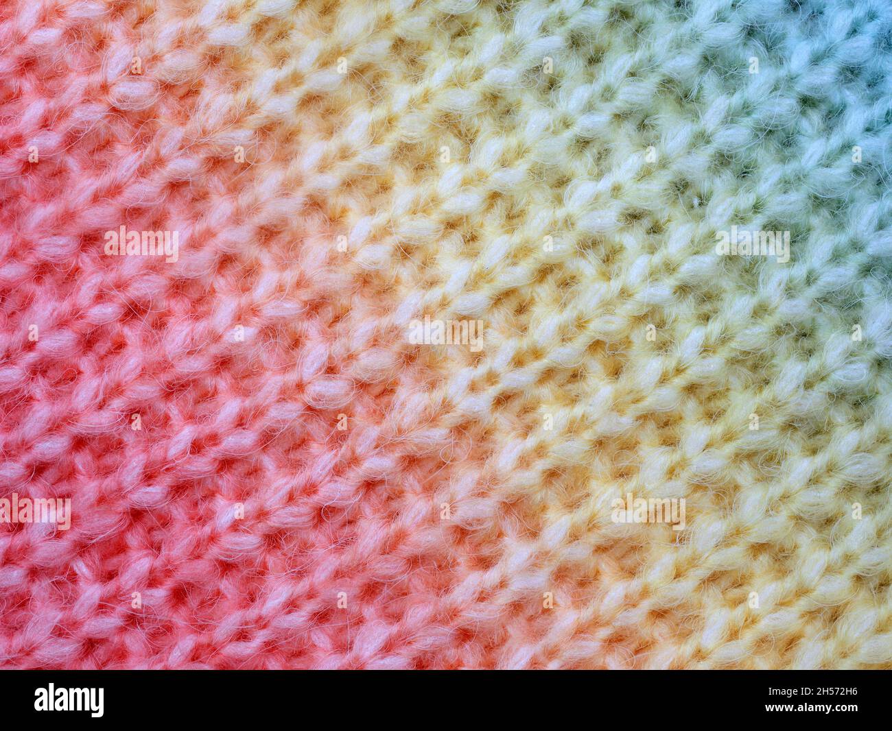 knitted cotton structure with a gradient from red to yellow to blue ...