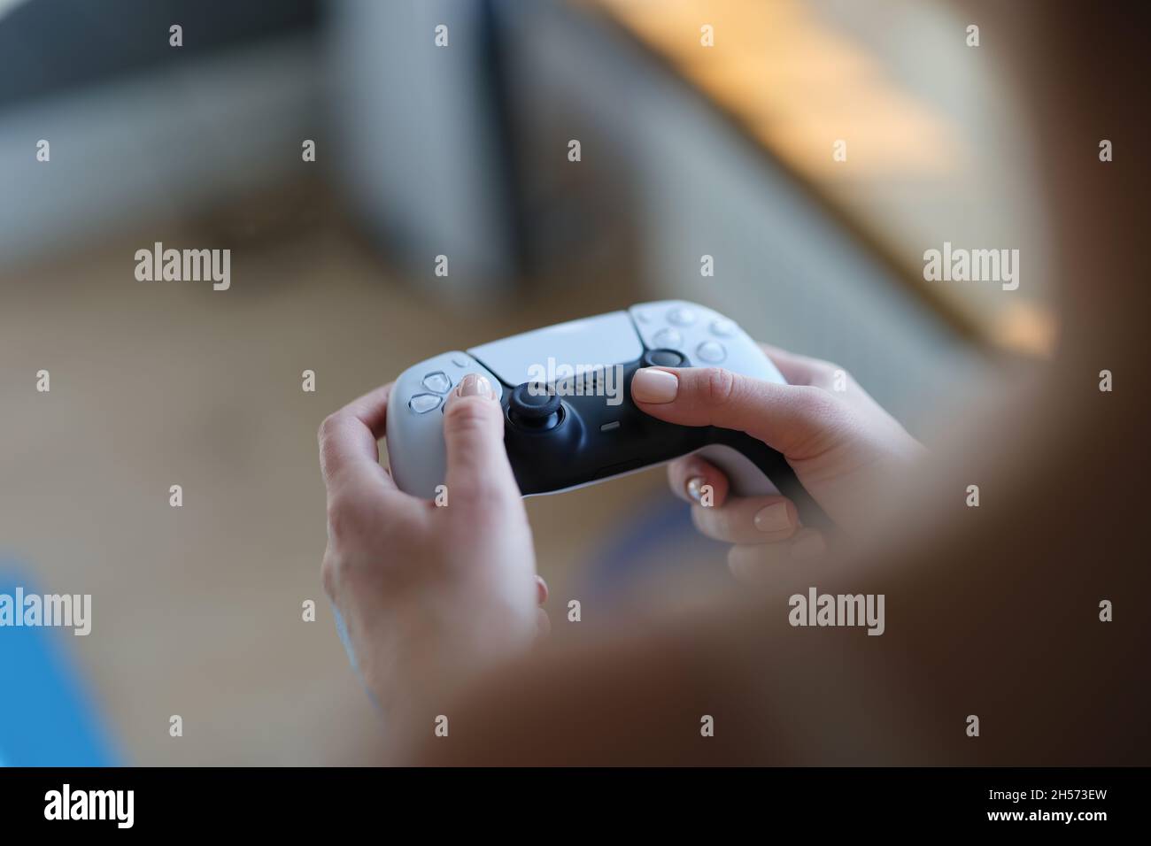 Hand holding playstation controller hi-res stock photography and images ...