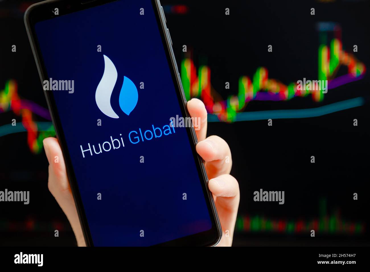 Ukraine, Odessa - October, 9 2021: Hand holding mobile with Huobi ...