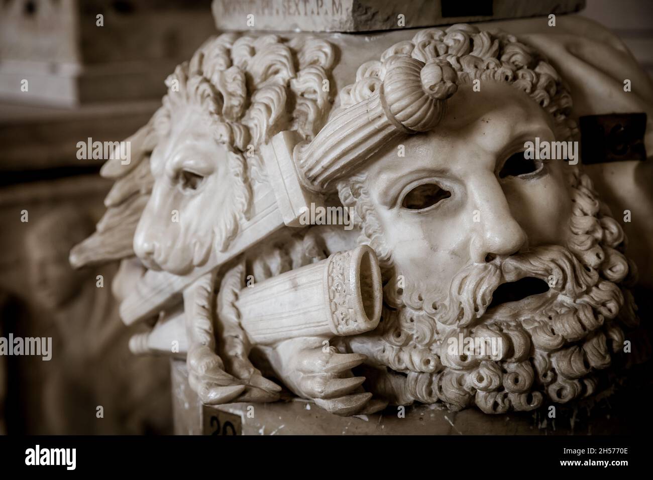 Ancient theatre mask, made of marble, located at the base of a Roman ...