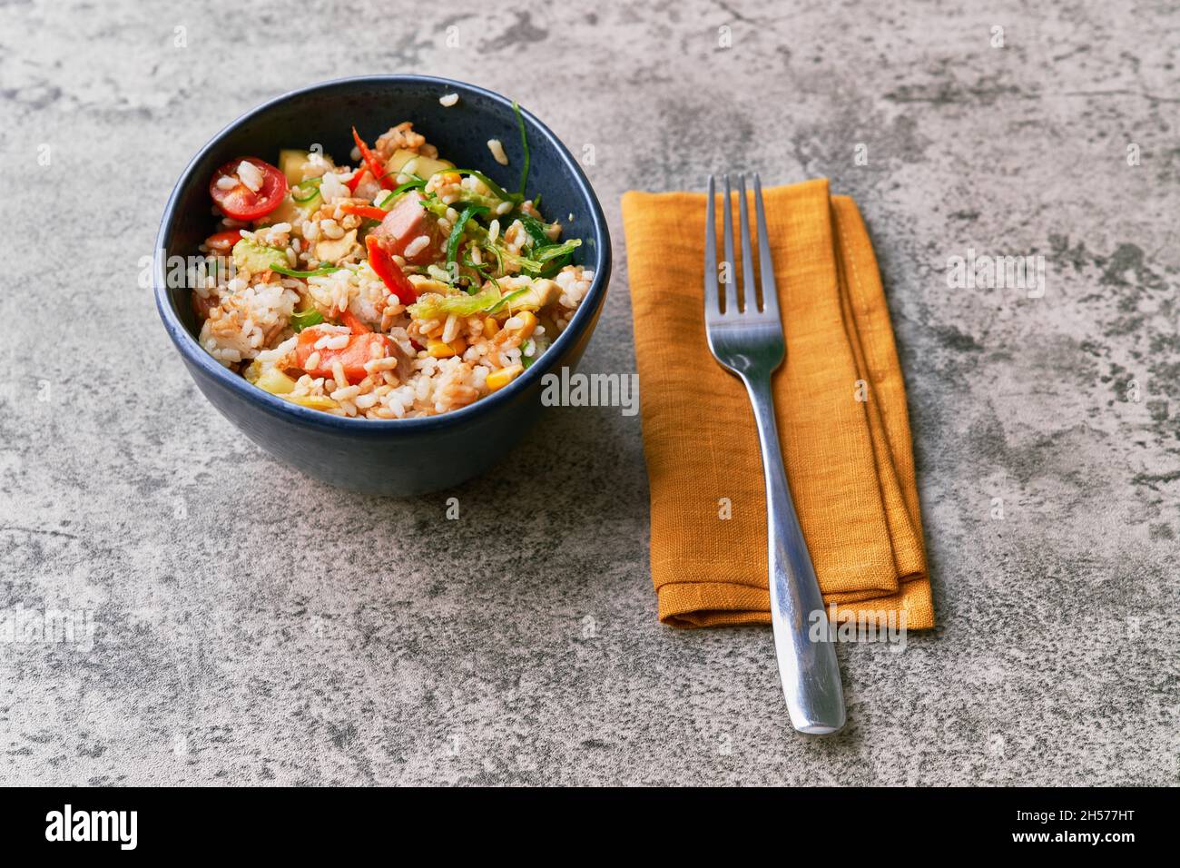 Delicious poke bowl on a concrete surface Stock Photo - Alamy