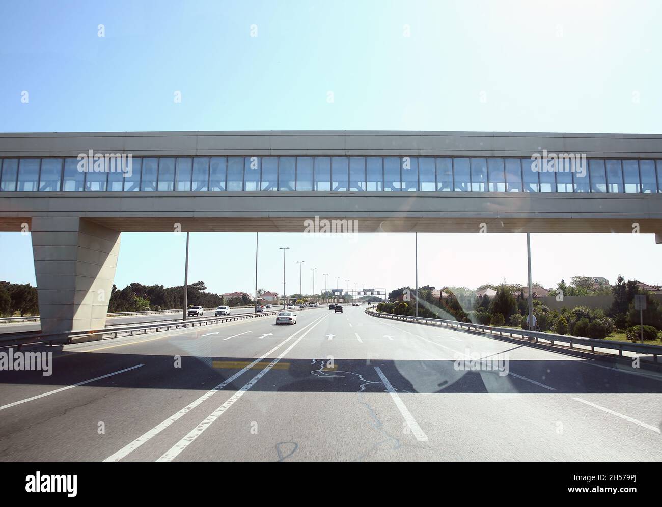 overground pedestrian crossing . Pedestrian bridge across the highway ...