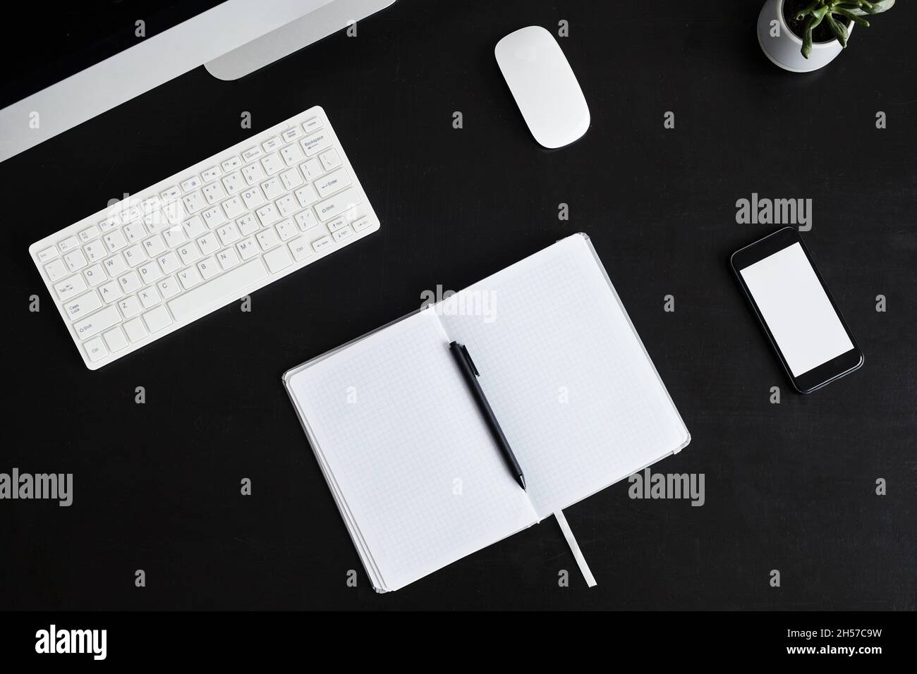 Minimal top view background of opened planner at black desk, copy space ...