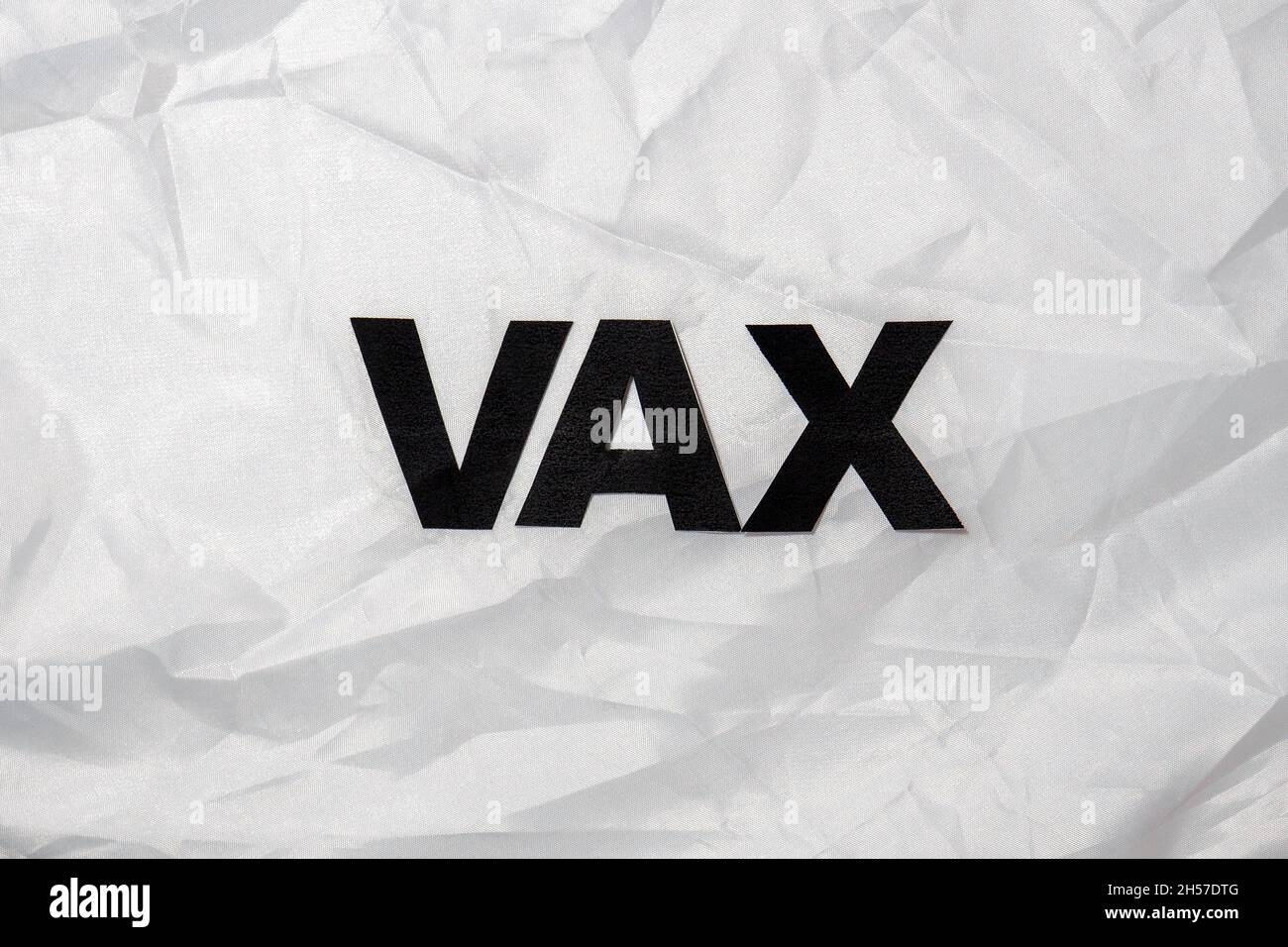 The word VAX on white crumpled background, top view, Vax declared The ...