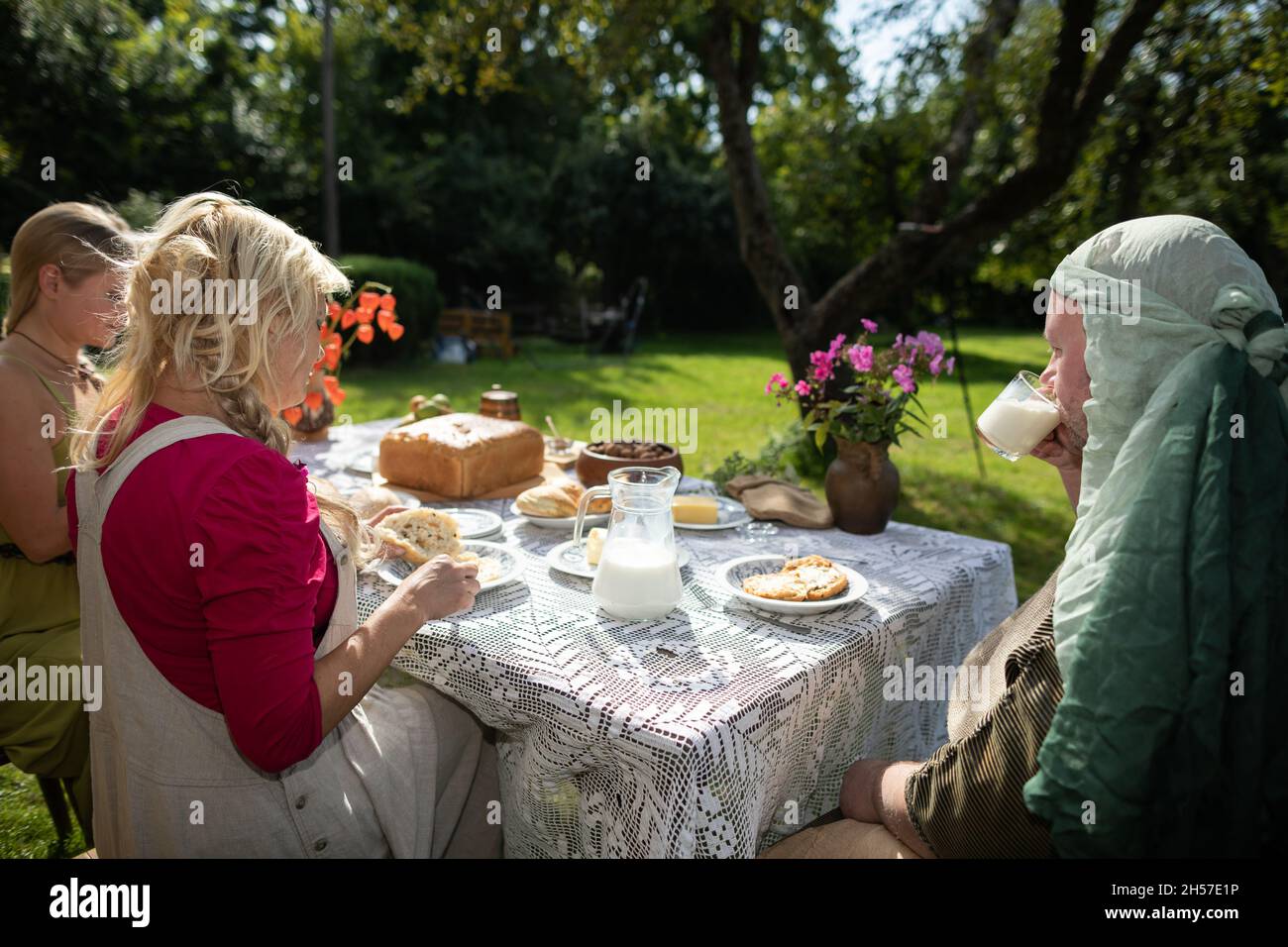 Son drinks fresh cow's milk from a glass. Breakfast in the countryside ...