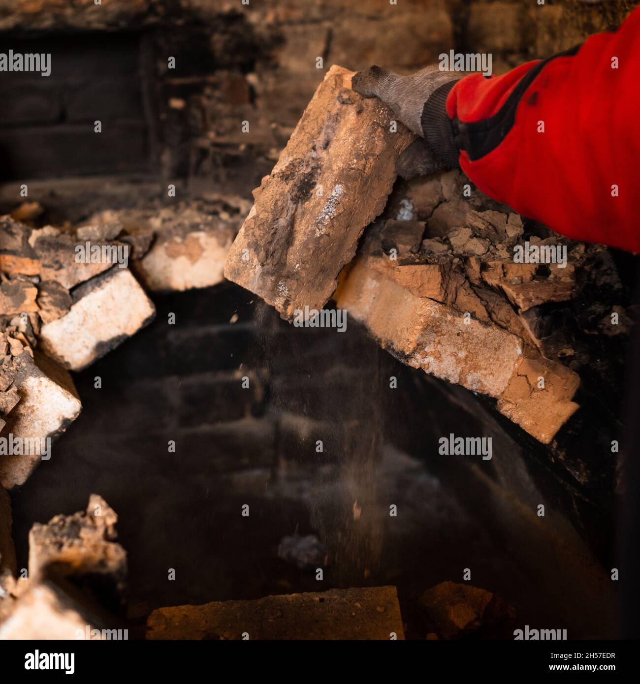 Old cooking stove, brick in soot, stove in the form of an arch ...