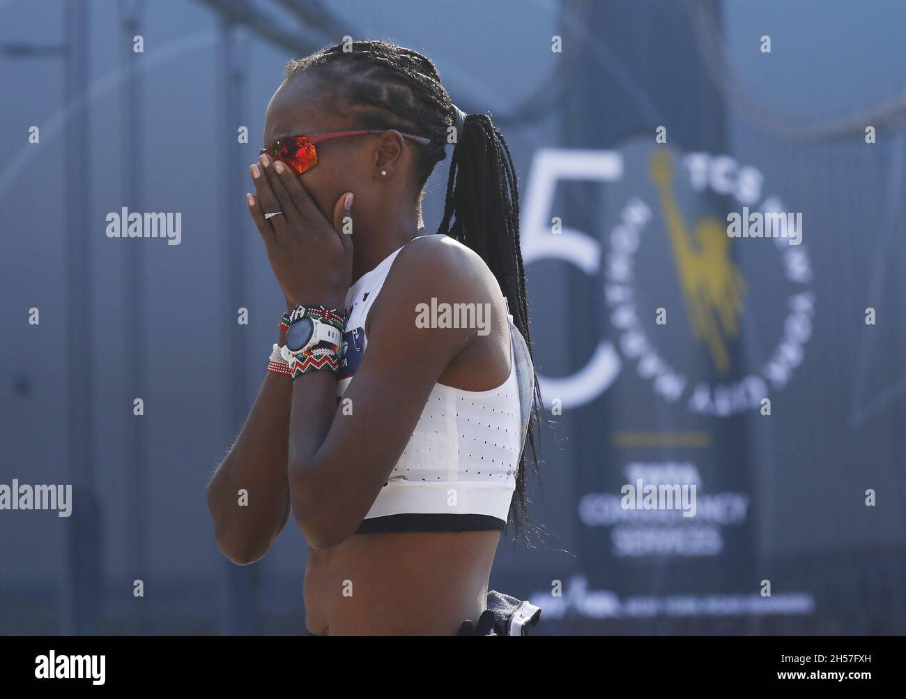 New York, United States. 07th Nov, 2021. Runners react after they cross ...