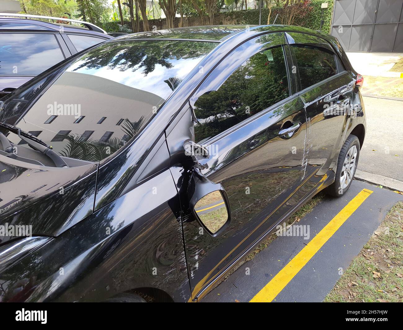 Accident with damaged car with scratches and dents all over the side ...