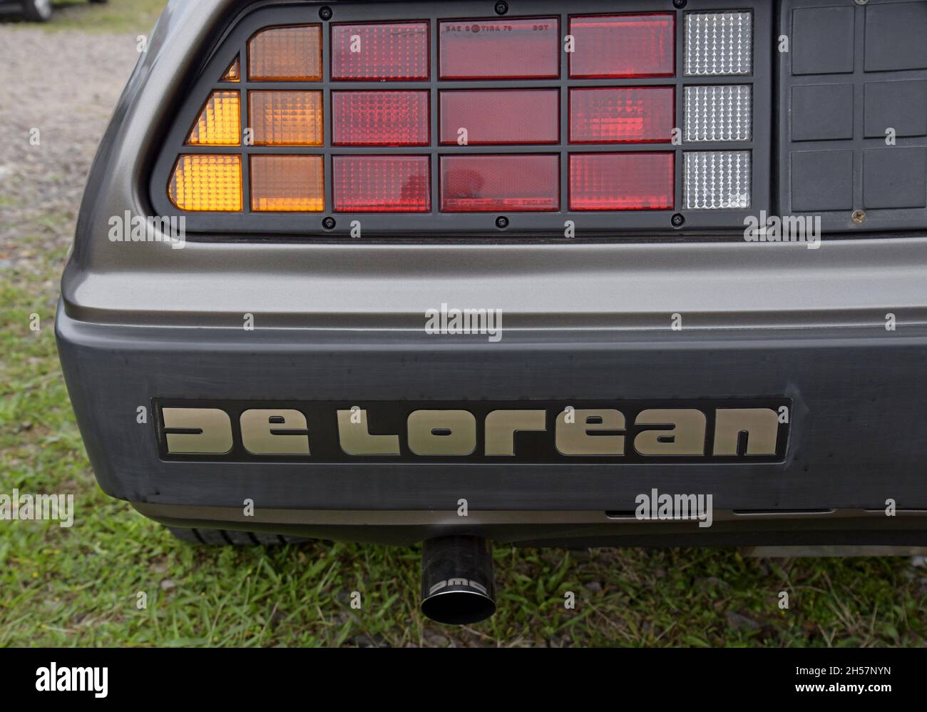View of rear light cluster and name badge on a Delorean classic car ...