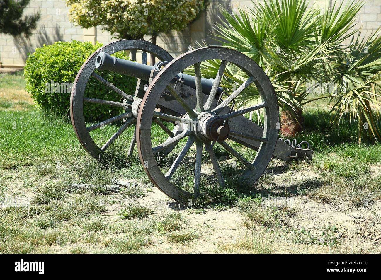 old cannon stands in the park in summer. horizontal frame . A cannon ...