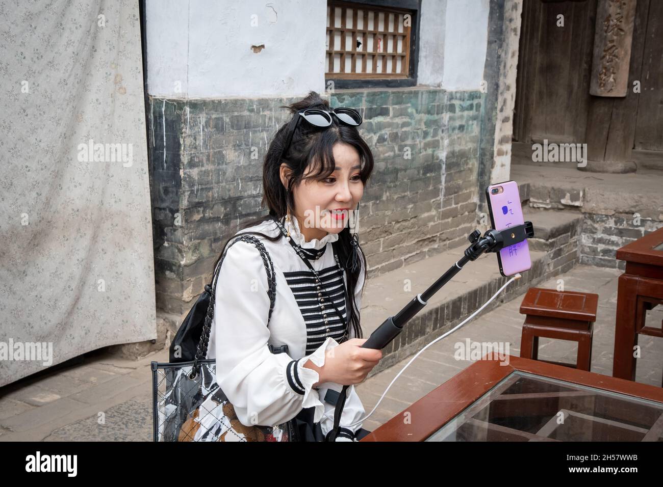 Chinese vlogger films self at Dangjia Village in Shaanxi Province ...