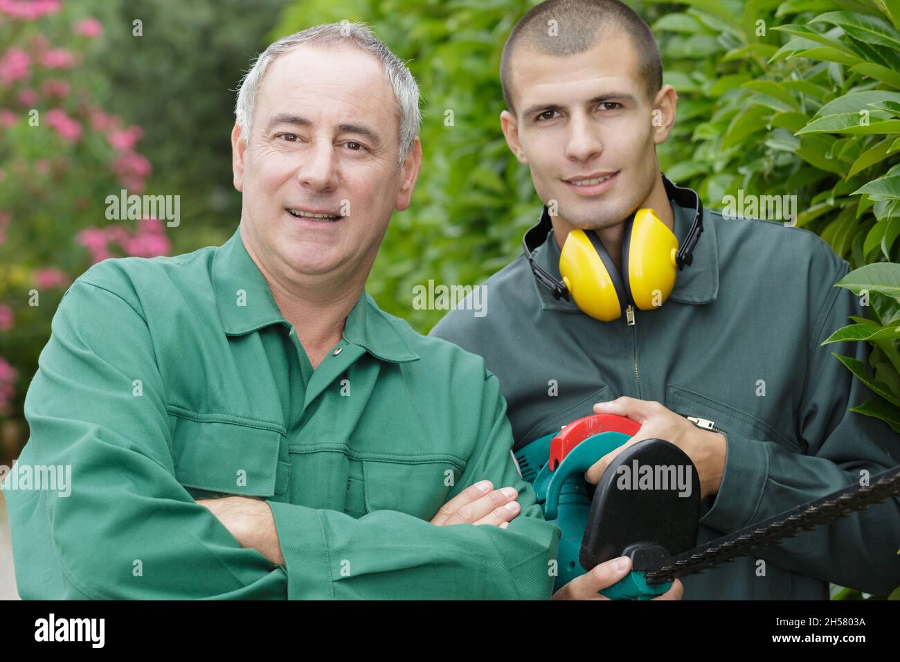 Gardeners cutting the bush scissors hi-res stock photography and images ...
