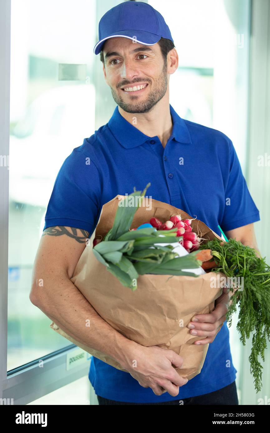 Man carrying groceries hi-res stock photography and images - Alamy