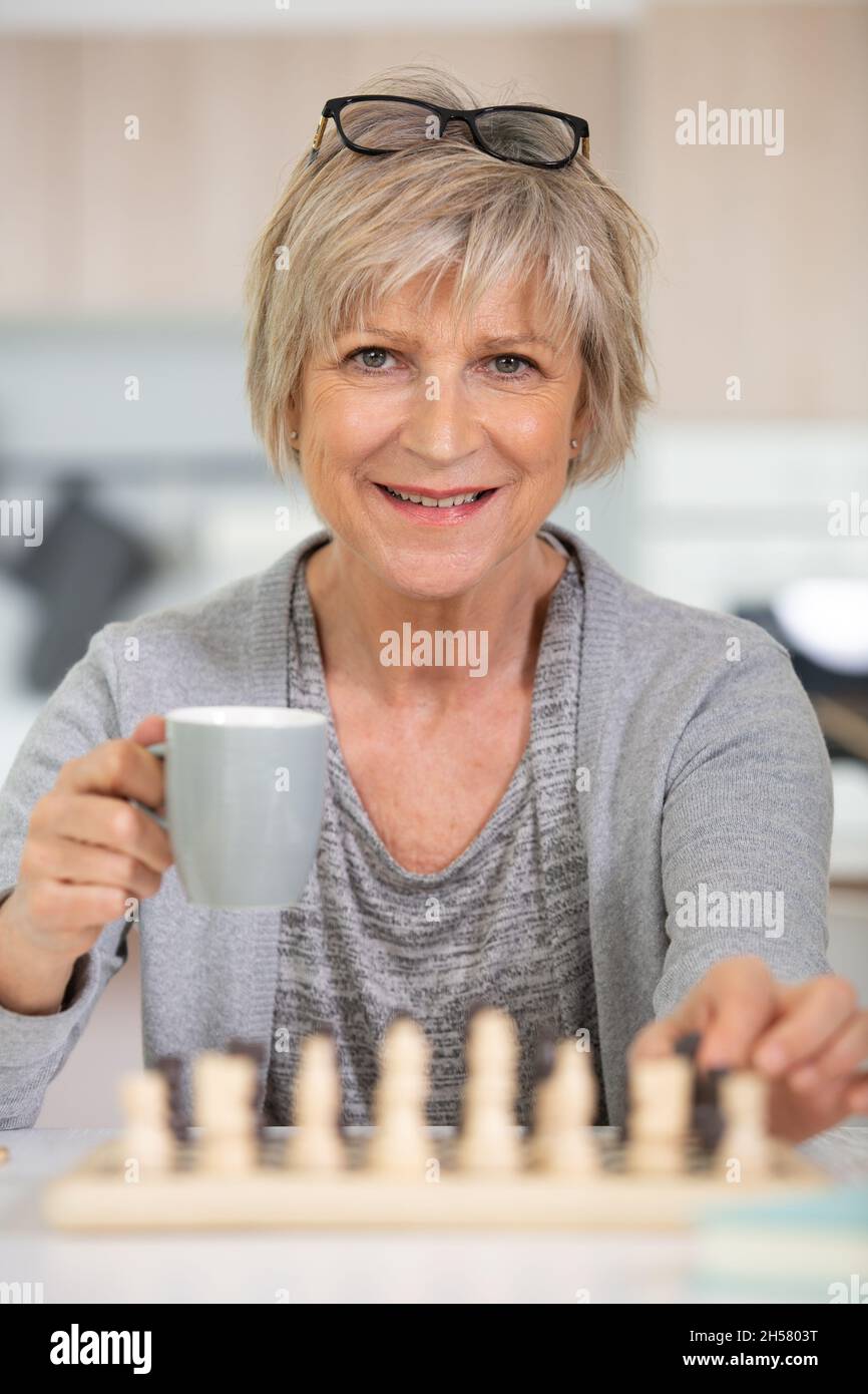 Old lady playing chess hi-res stock photography and images - Alamy