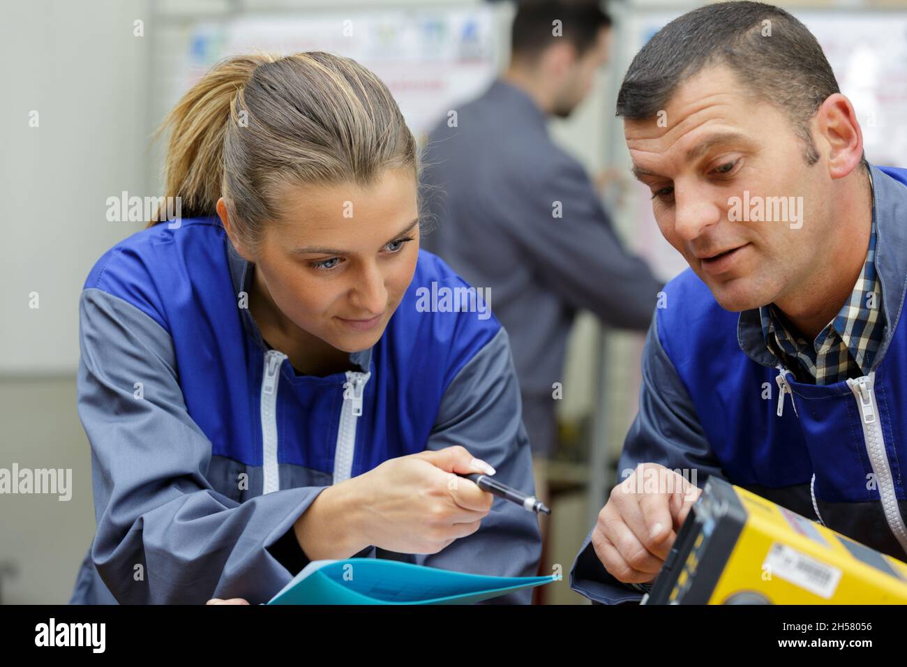 engineers checking the temperature of a machine Stock Photo - Alamy