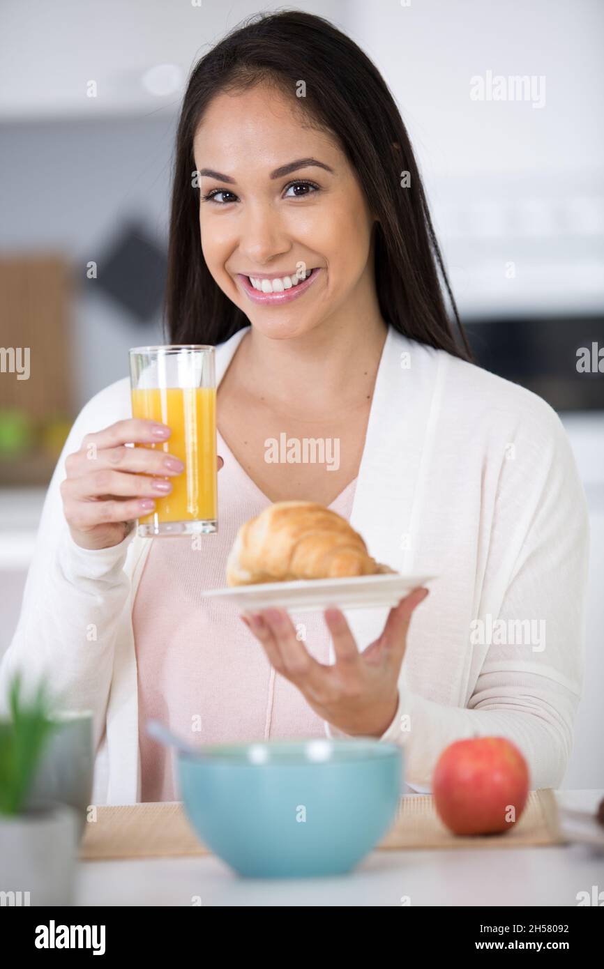 portrait of a beautiful woman at the breakfast table Stock Photo - Alamy
