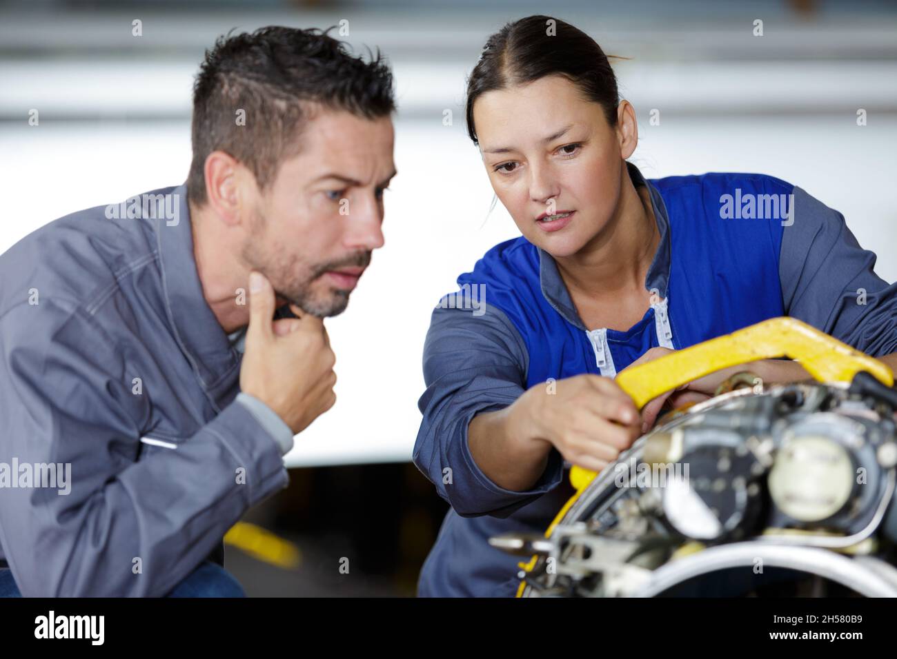 male and female mechanics working together Stock Photo - Alamy