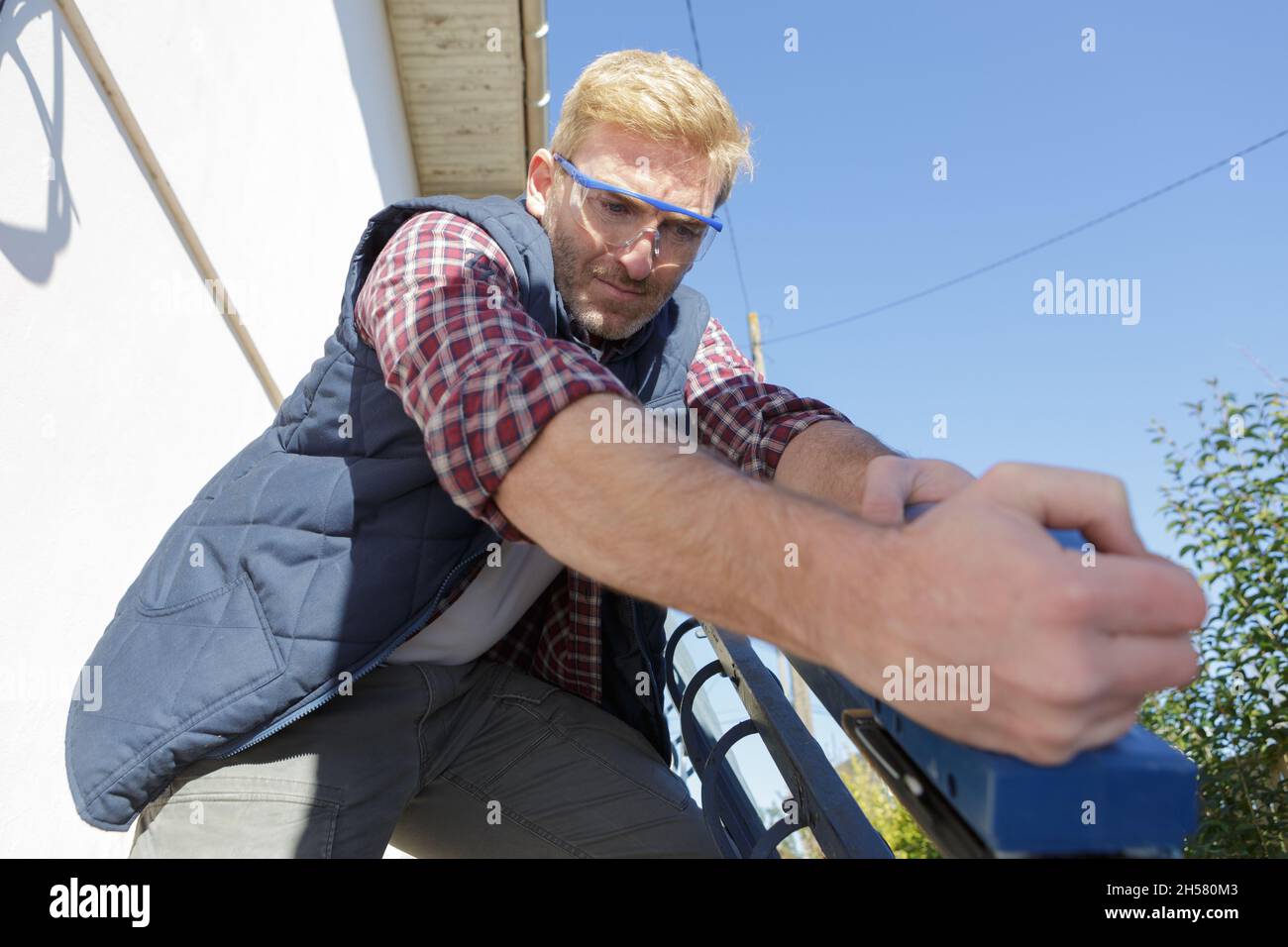 young construction employee working posing at building site Stock Photo ...