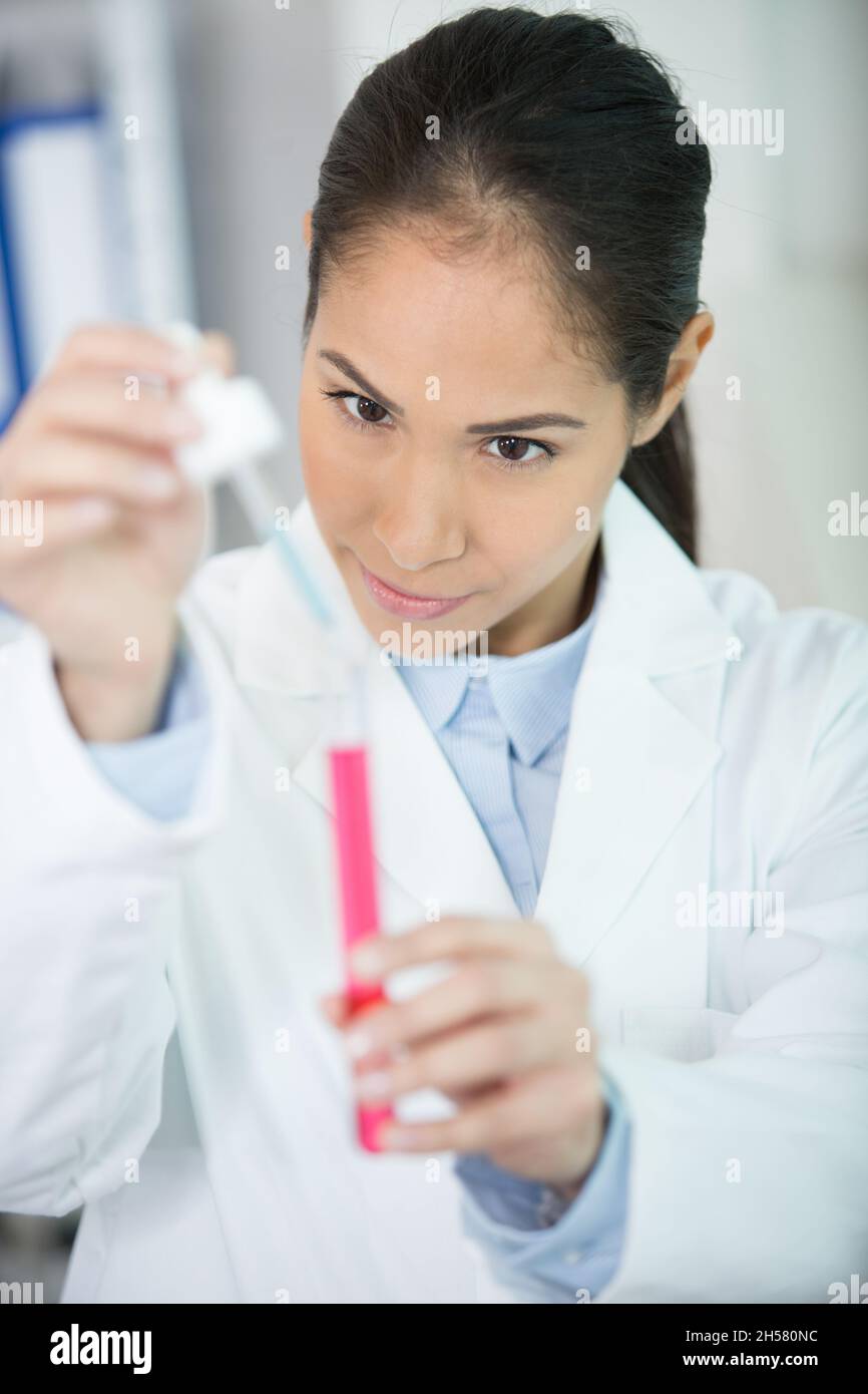 doctor drips from a pipette into a test tube Stock Photo - Alamy
