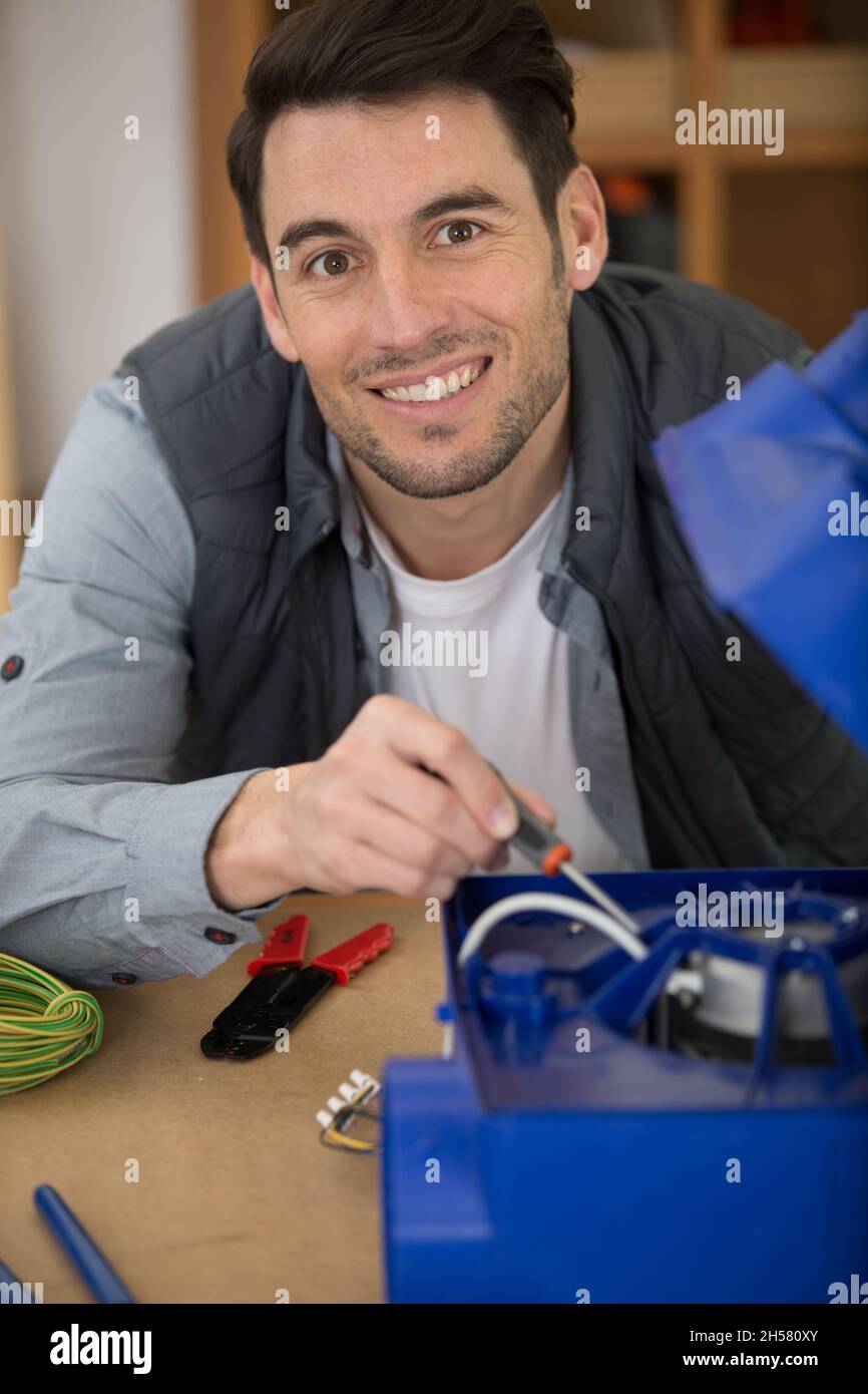 electrician wiring up an electrical unit Stock Photo - Alamy