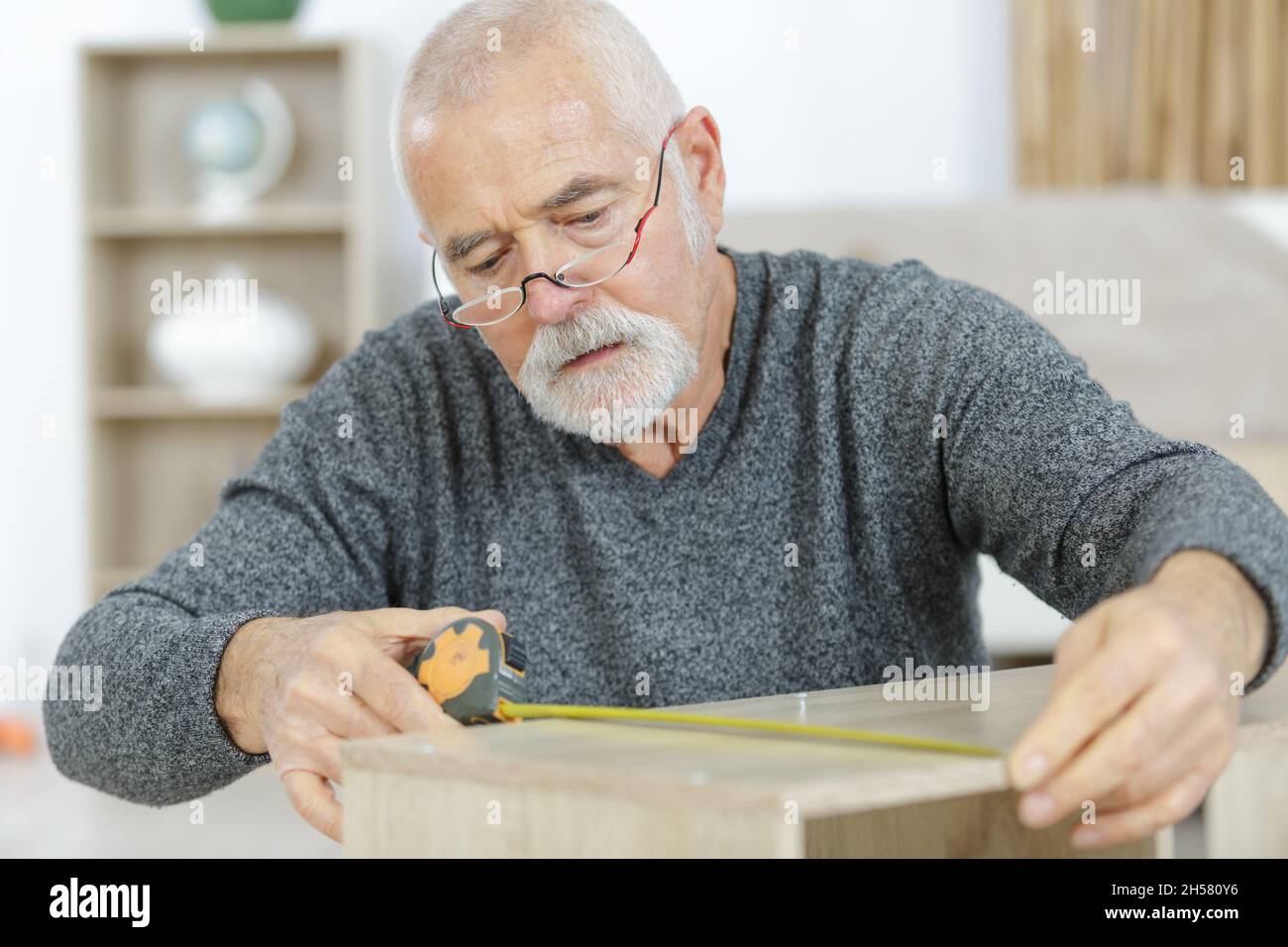 a senior man during diy improvement Stock Photo - Alamy