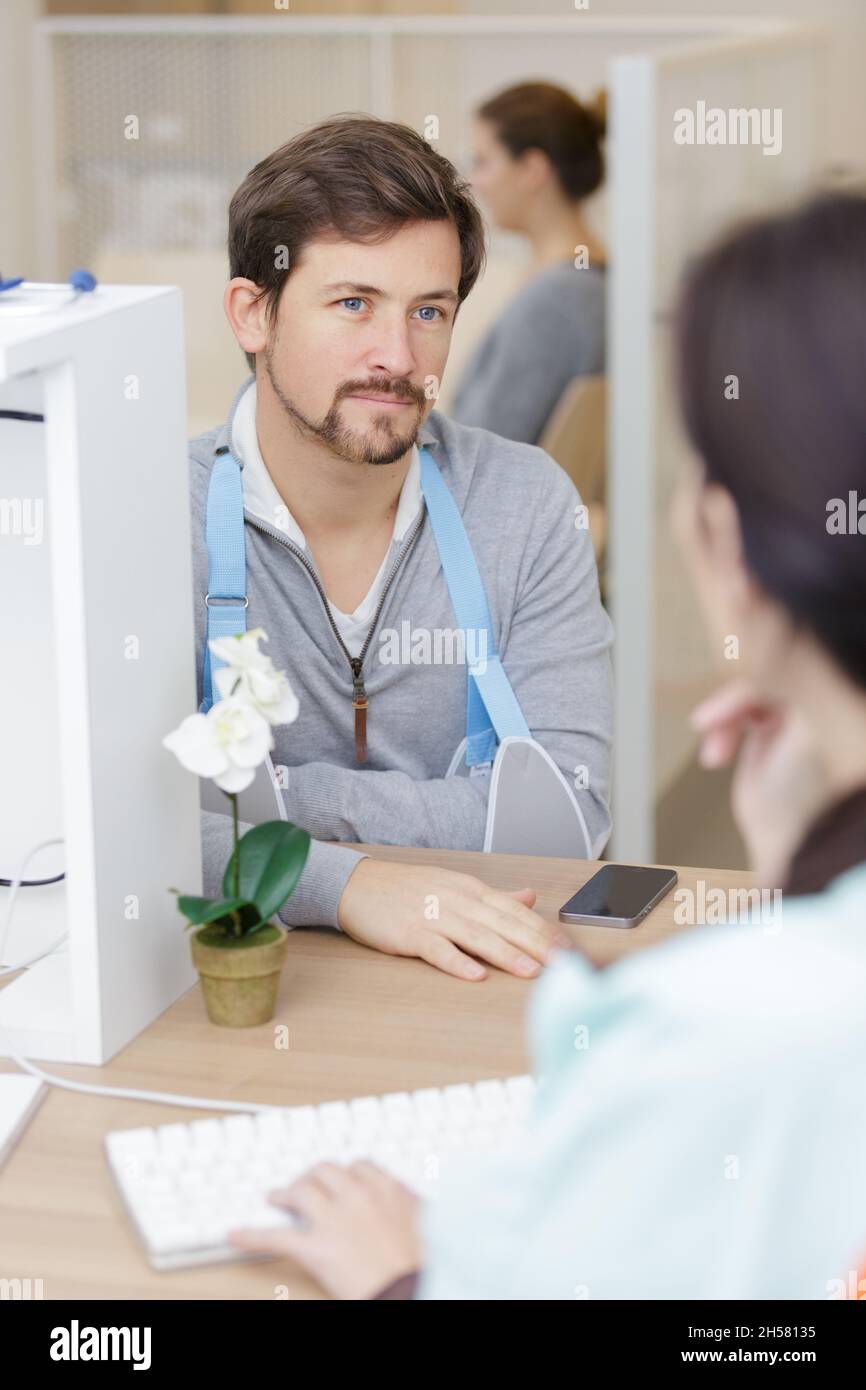 male patient with doctor in hospital desk Stock Photo - Alamy