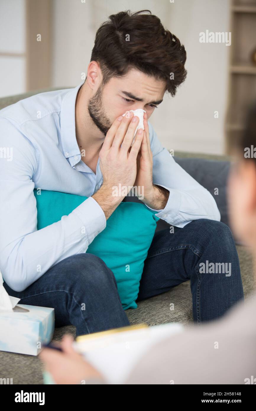 man releasing his emotions during therapy session Stock Photo - Alamy