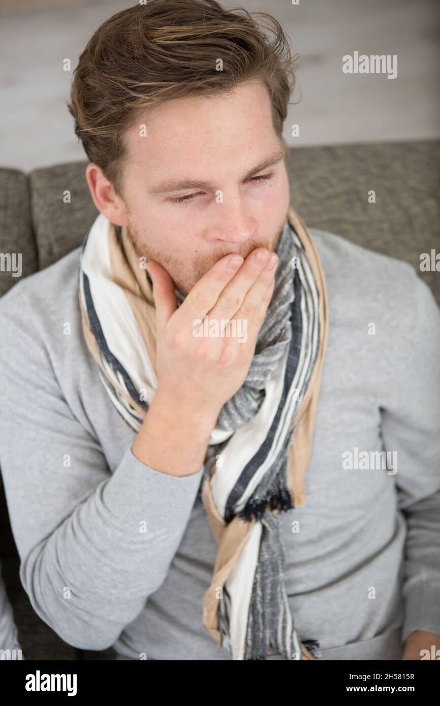 Yawning tired man home office hi-res stock photography and images - Alamy