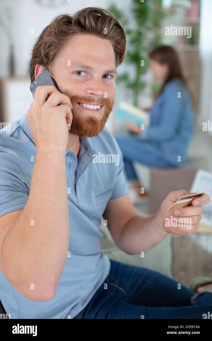 man making credit card payment over the telephone Stock Photo - Alamy