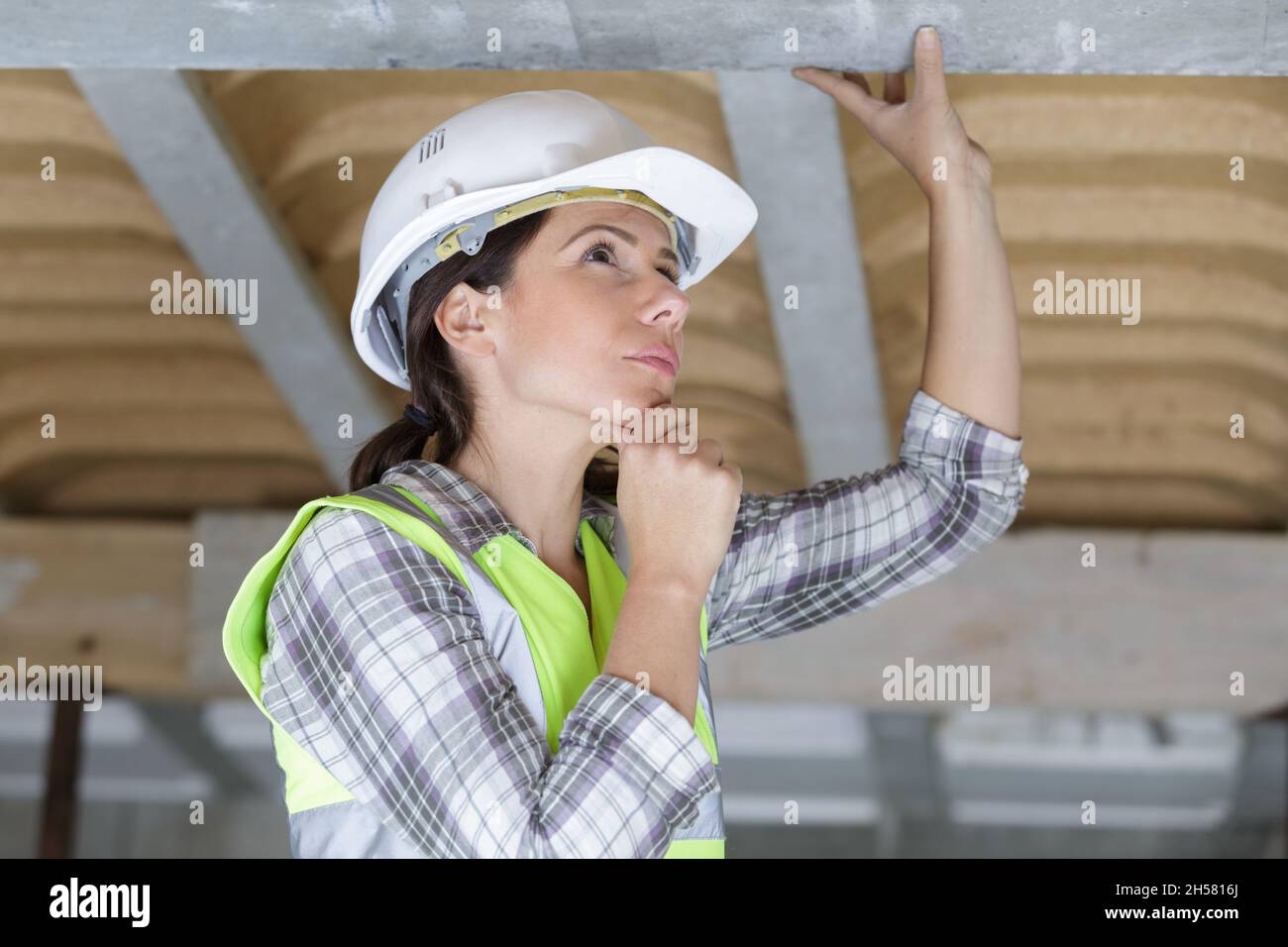 engineer construction worker woman doubt expression Stock Photo - Alamy