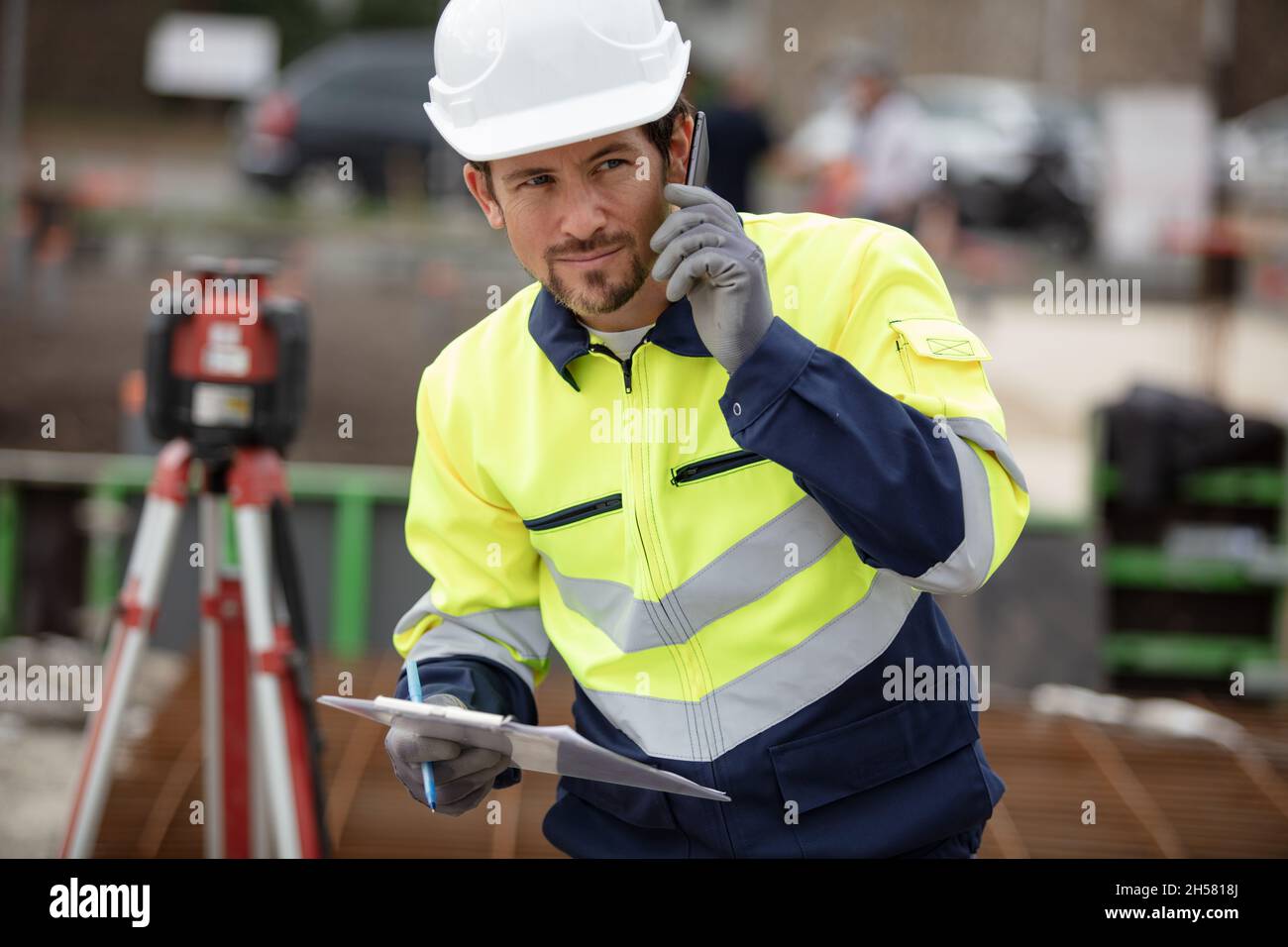 builder next to foundation of the building Stock Photo - Alamy