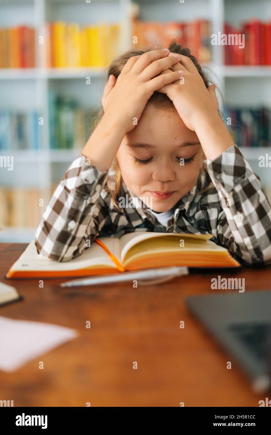 Close-up front view of frustrated exhausted primary child school girl ... Close-up front view of frustrated exhausted primary child school girl ...