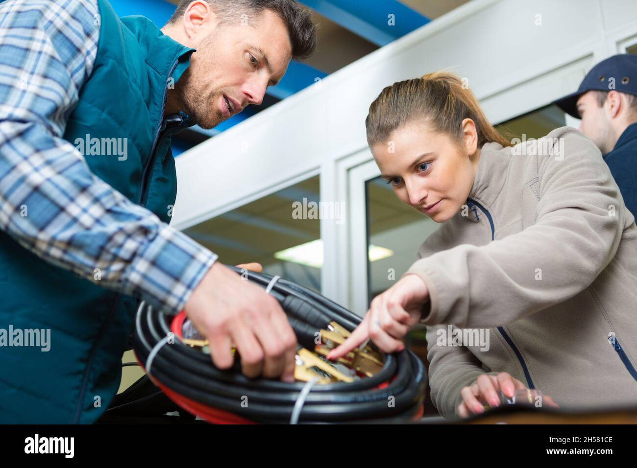 manager controlling employees during work Stock Photo - Alamy