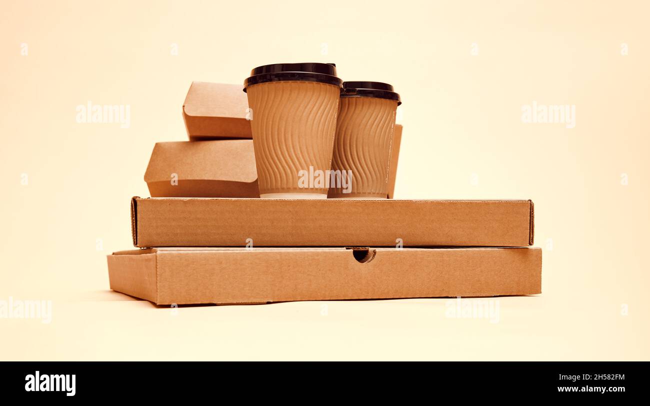 Cardboard food containers for takeaway of delivery service. Pizza, pie ...