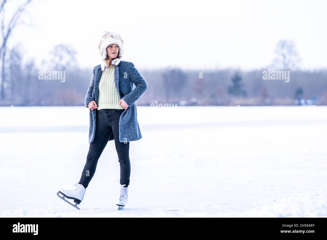 ice skating on a frozen pond in winter Stock Photo - Alamy