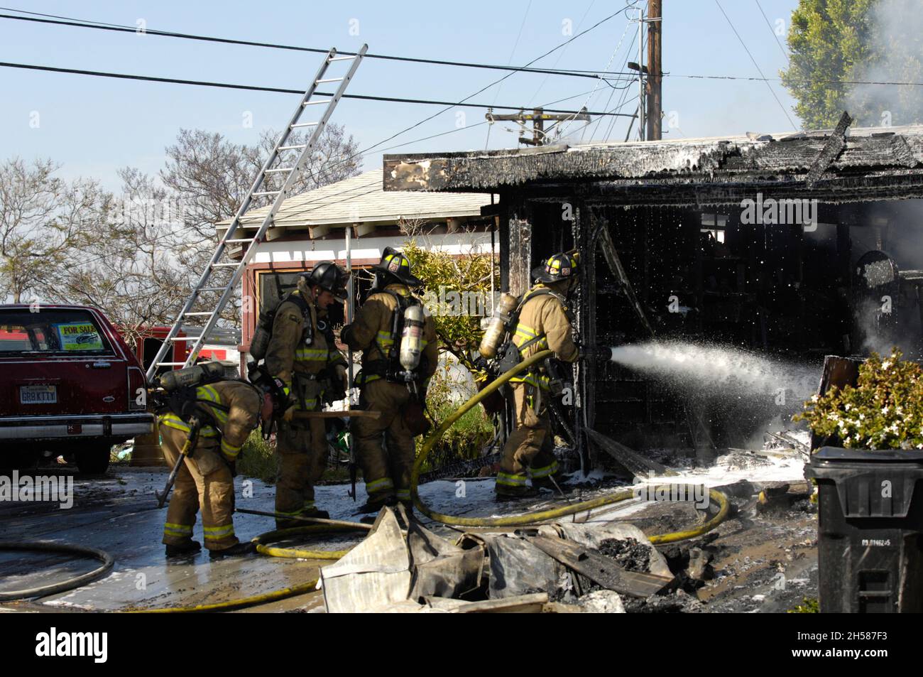 San Diego Fire-Rescue firefighters working a structure fire in Mission ...