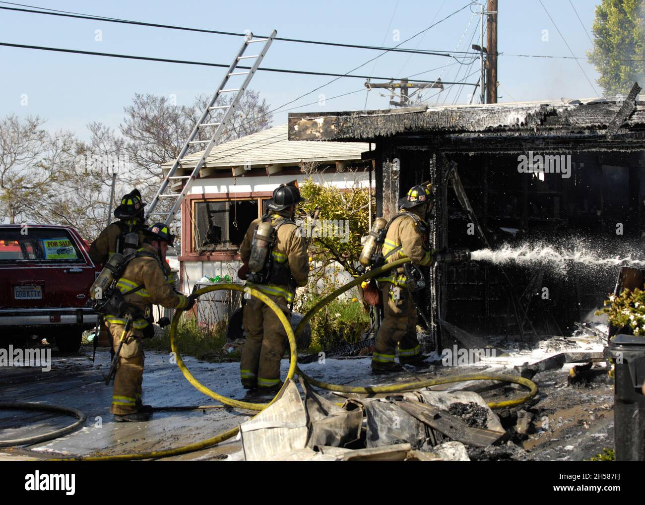 San Diego Fire-Rescue firefighters working a structure fire in Mission ...