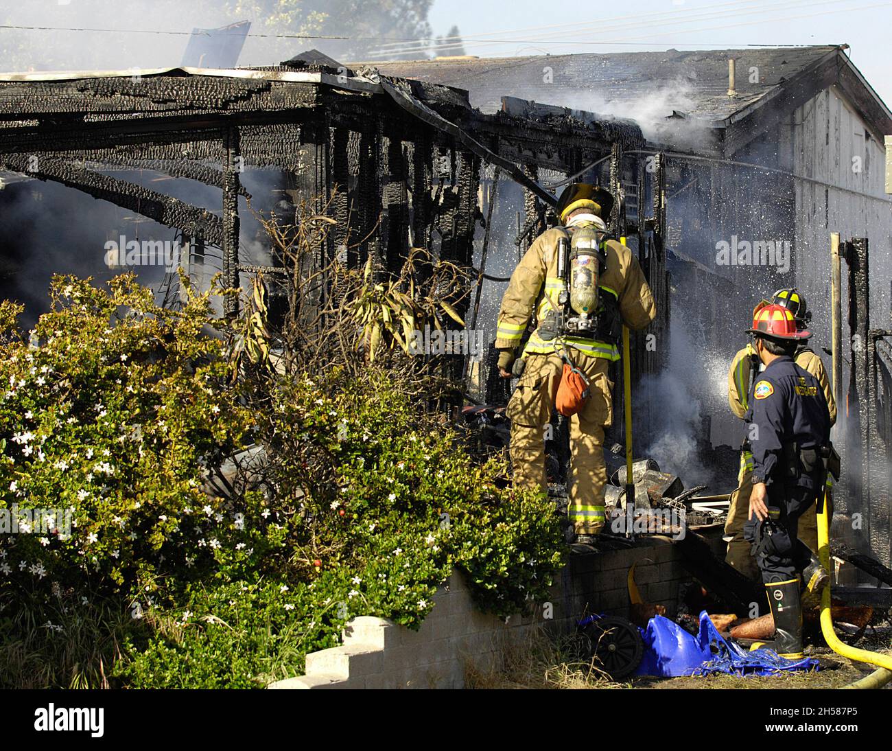 San Diego Fire-Rescue firefighters working a structure fire Stock Photo ...