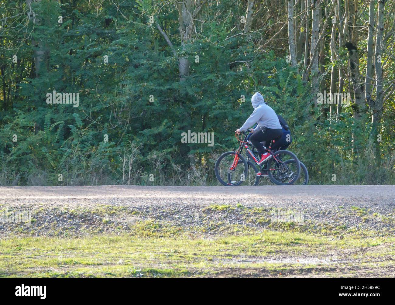 two recreational cyclists travel a stone track in the English ...