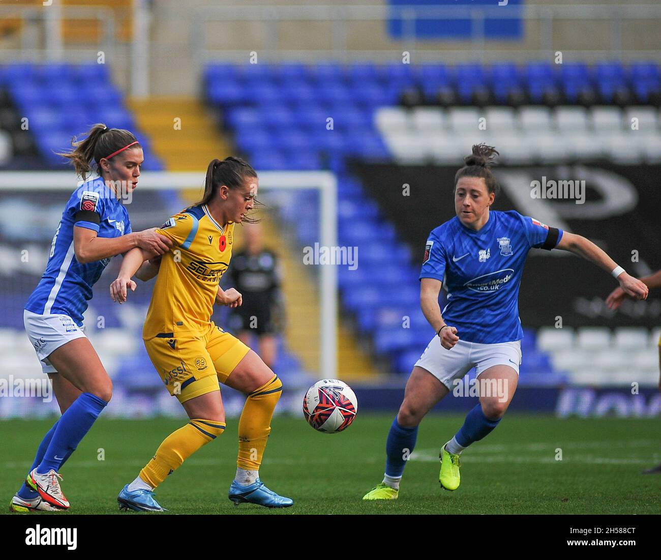 Reading player shields the ball from Birmingham defender During the ...