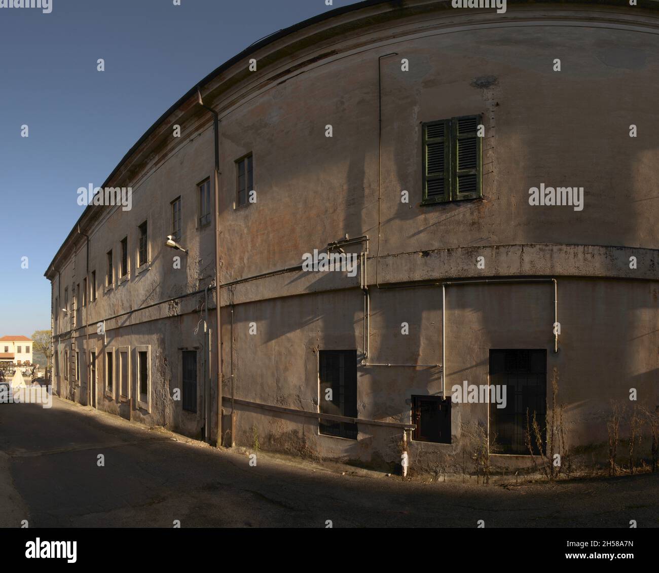 Oblique sunlight on rear wall of Catholic seminary in Arona, Italy ...