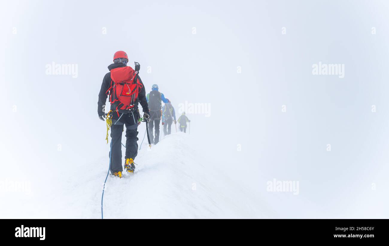 Group of glacier mountaineers on a rope Stock Photo - Alamy