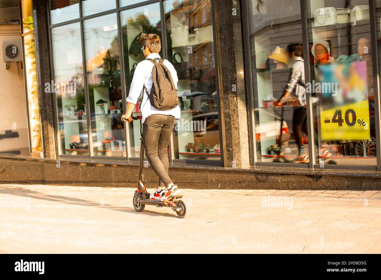 The high school student goes to study on a scooter Stock Photo - Alamy